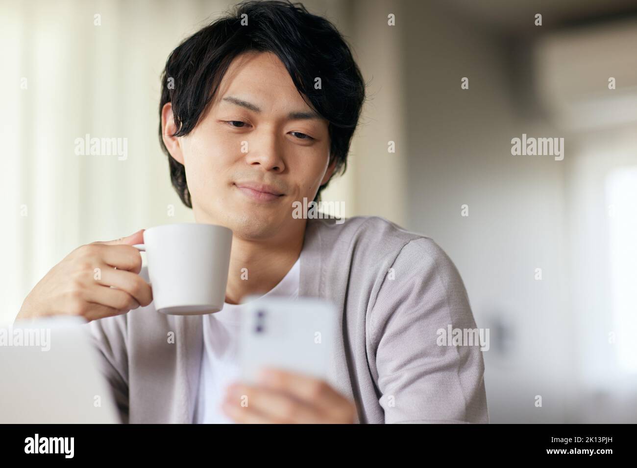 Japanese man working from home Stock Photo - Alamy