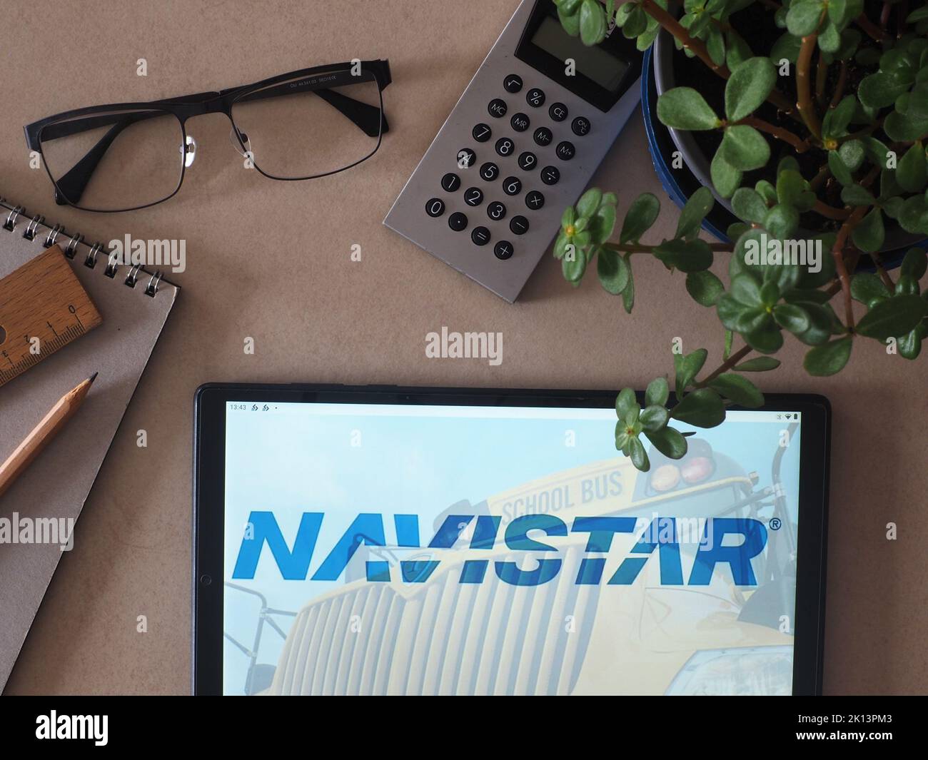 In this photo illustration, Navistar brand of Traton Group logo seen ... In this photo illustration, Navistar brand of Traton Group logo seen ...