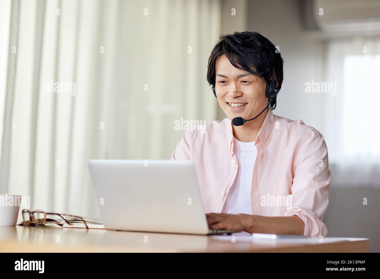 Japanese man working from home Stock Photo - Alamy