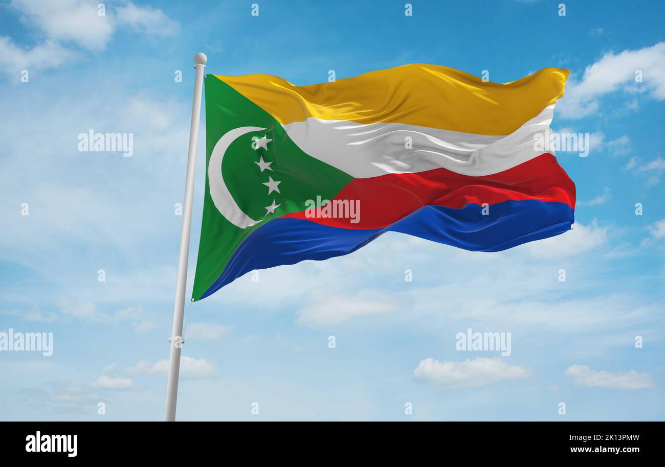 flag of African Arabs Comorians at cloudy sky background, panoramic ...