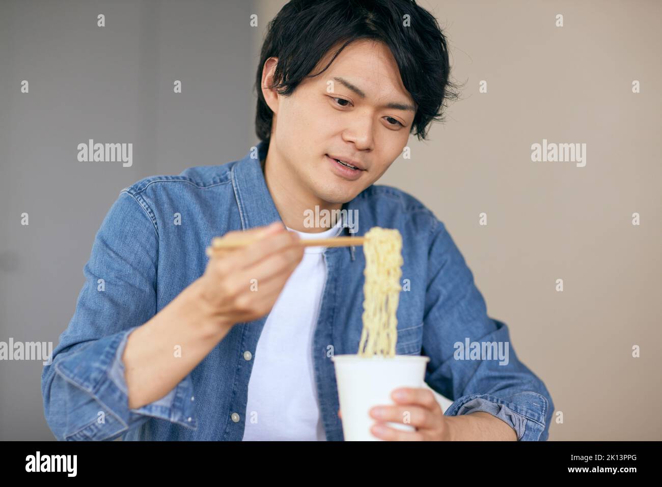 Japanese man eating at home Stock Photo - Alamy