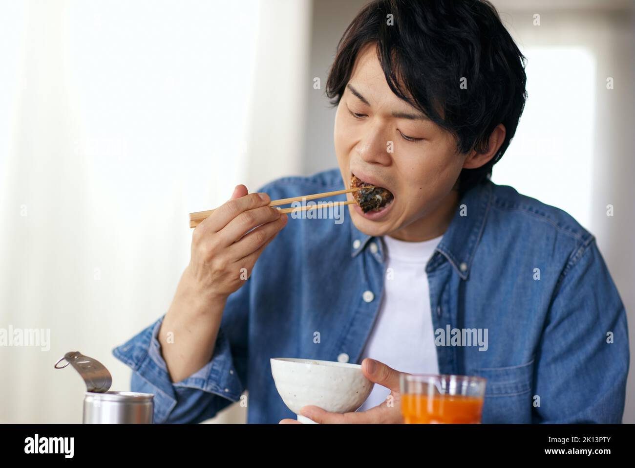 Japanese man eating at home Stock Photo - Alamy