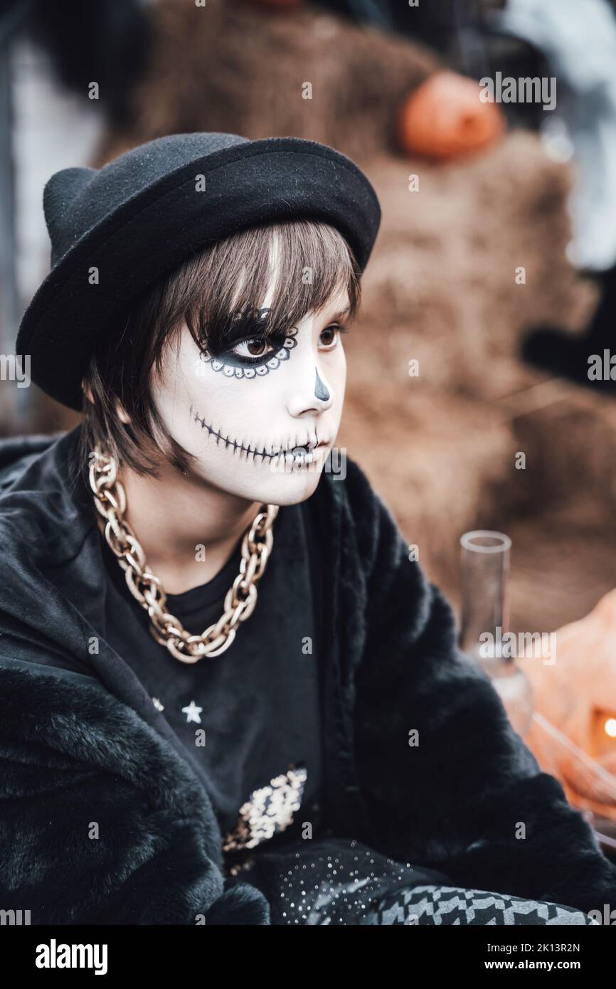 Beautiful scary little girl celebrating halloween. Terrifying black ...