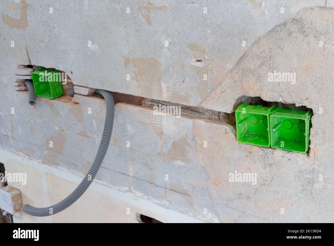 Electricity work in a wall for the renovation of a kitchen Stock Photo ...