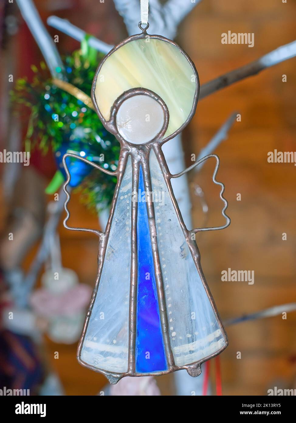 A collectible Christmas-tree decoration, an angel with nimbus, is on ...