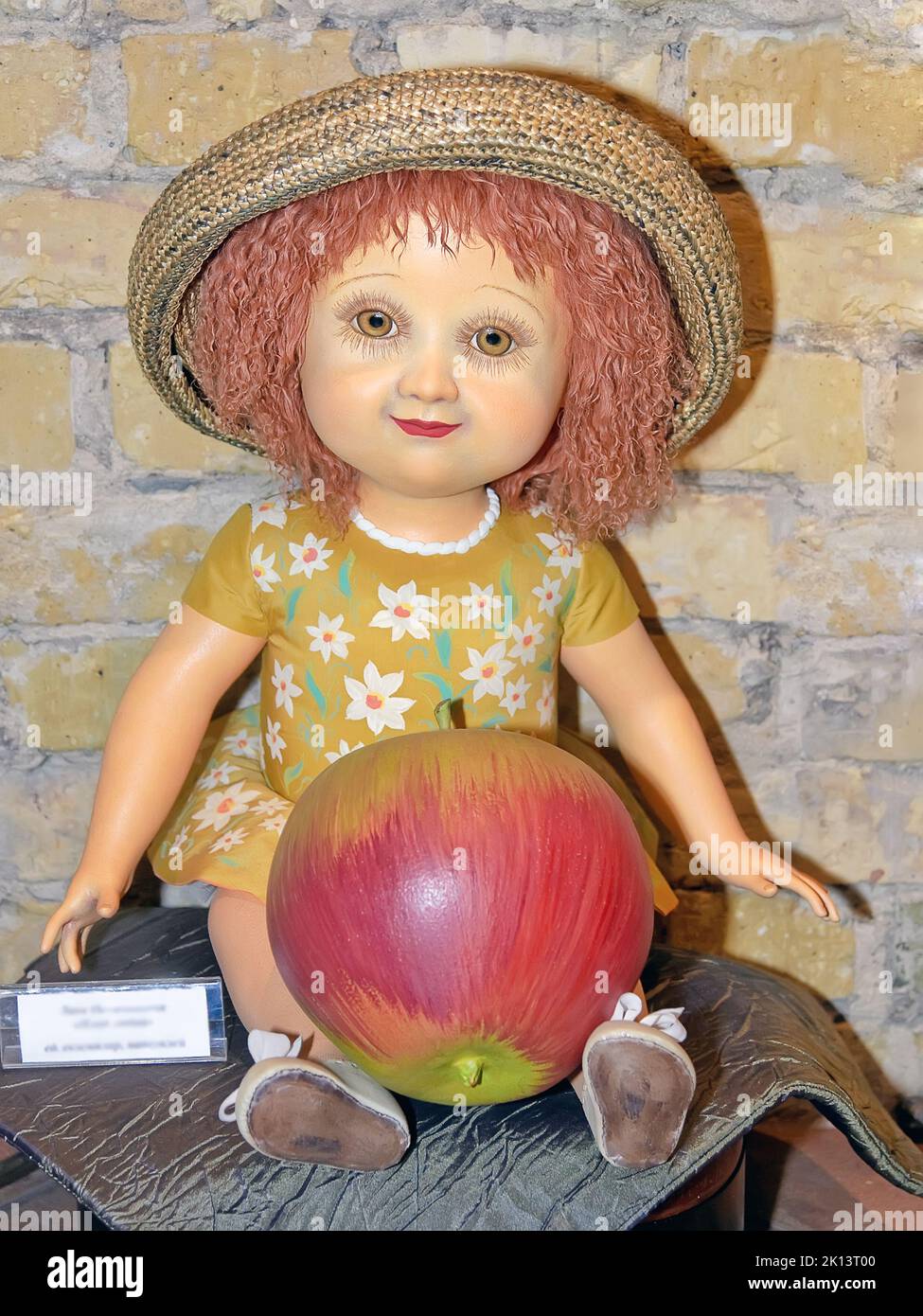 A collectible doll, a small girl with big apple, is on display at the ...