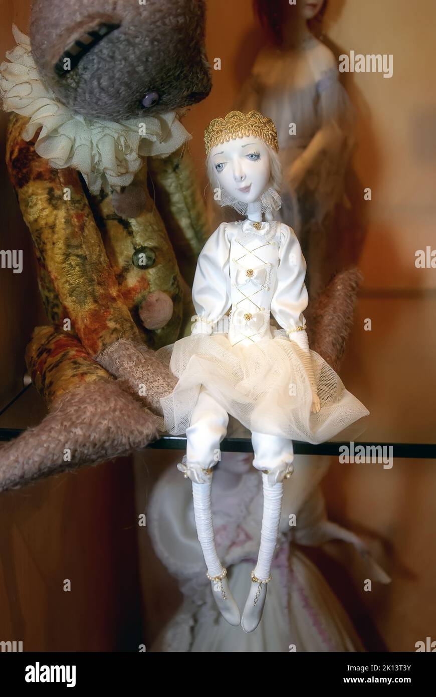 A collectible doll, a girl with golden headband, is on display at the ...