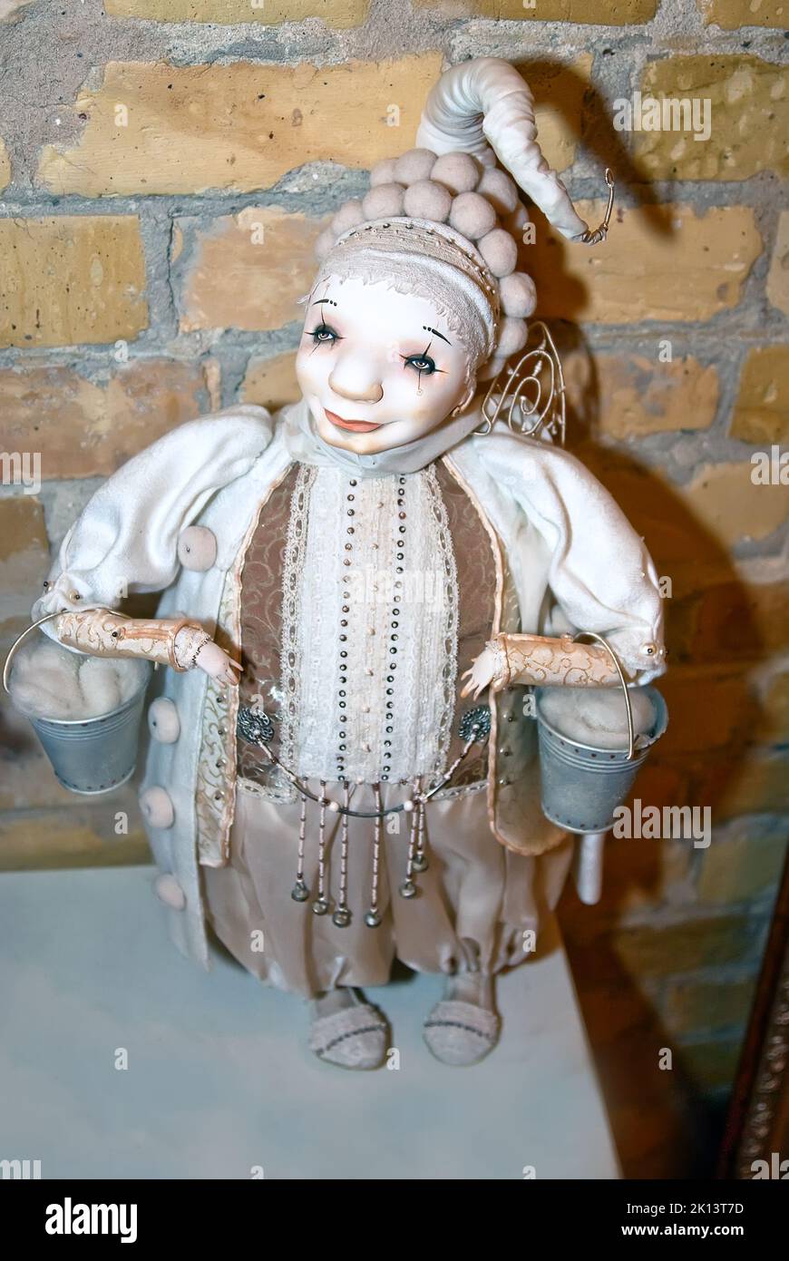 A collectible doll, a snowman with two bucketfuls, is on display at the ...