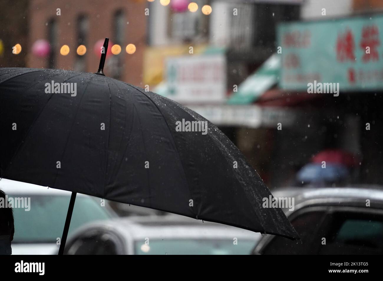 heavy rain in chinatown new york city manhattan Stock Photo - Alamy