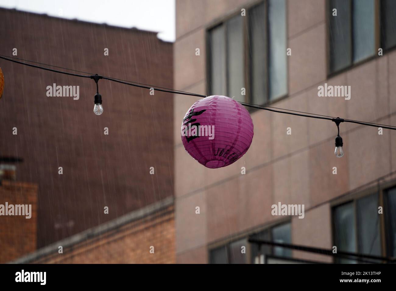 heavy rain in chinatown new york city manhattan Stock Photo - Alamy