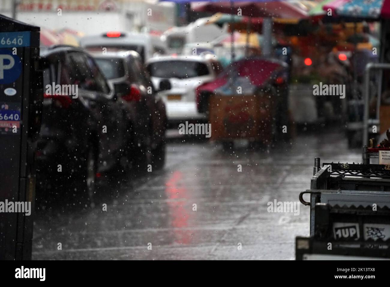 heavy rain in chinatown new york city manhattan Stock Photo - Alamy