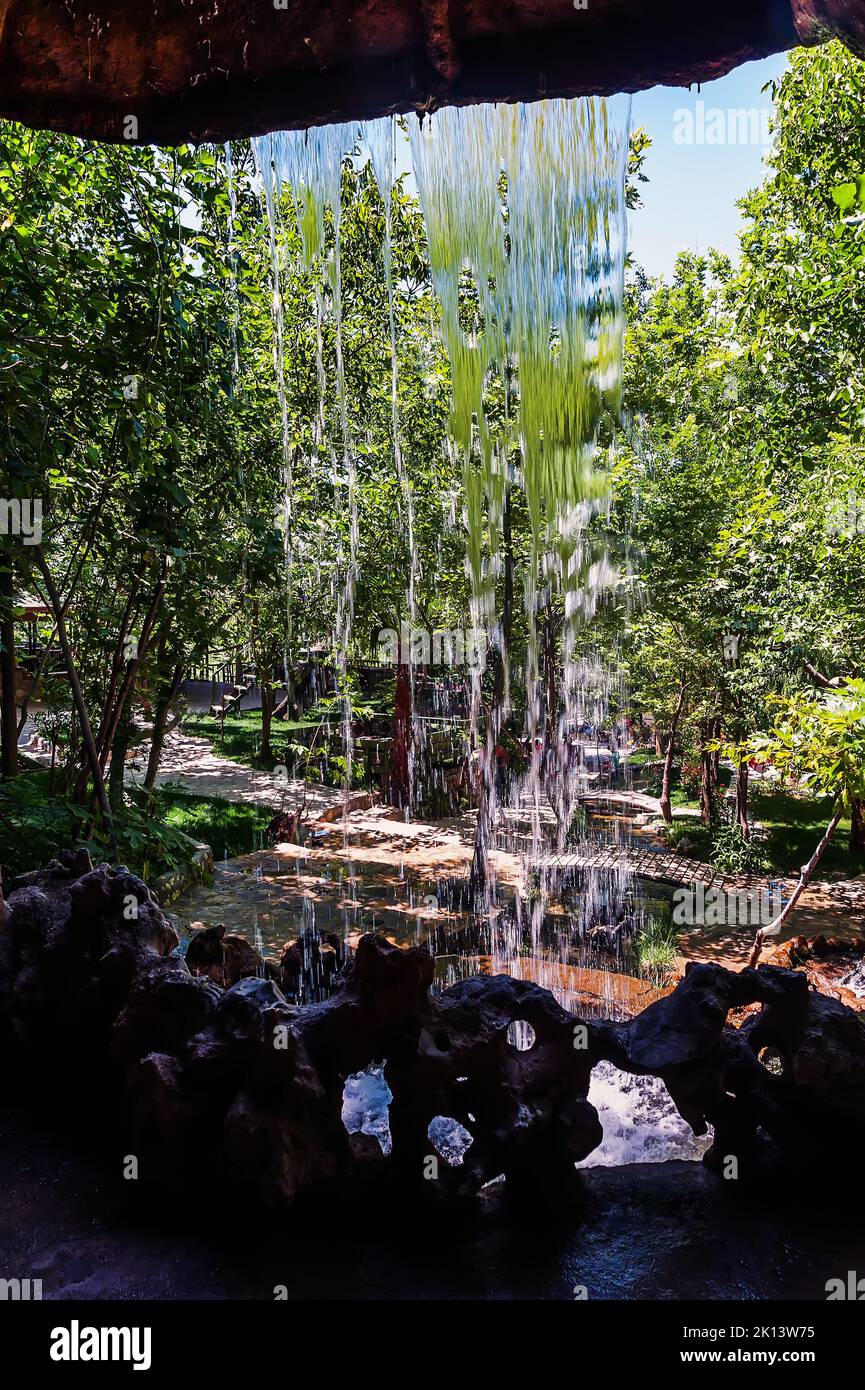Waterfall through a hole in tree hi-res stock photography and images ...