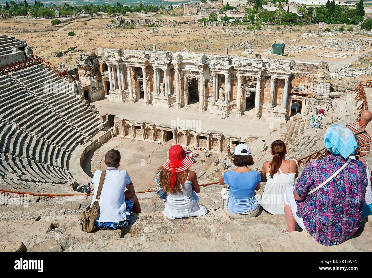 Unidentified tourists visit the ancient theater of the Roman city of ...