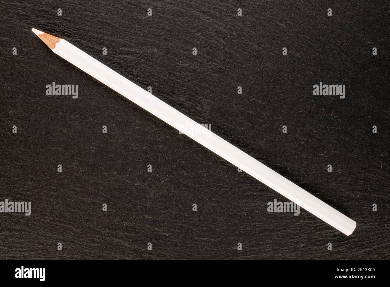 One pencil with a white lead on a slate stone, close-up, top view Stock ...