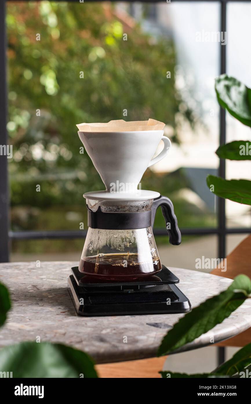 brewing coffee alternative method, coffee funnel stand on scales and ...