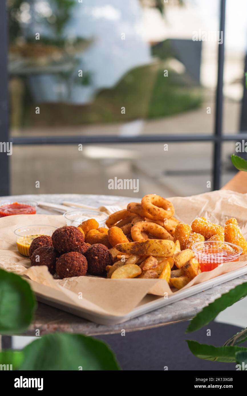 Large beer set of french fries, chicken nuggets and onion rings Stock ...