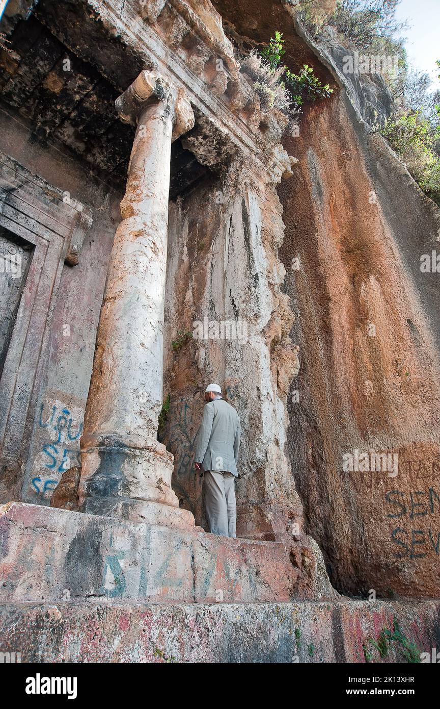 Unidentified man at the Tomb of Amyntas, known as the Fethiye Tomb is ...