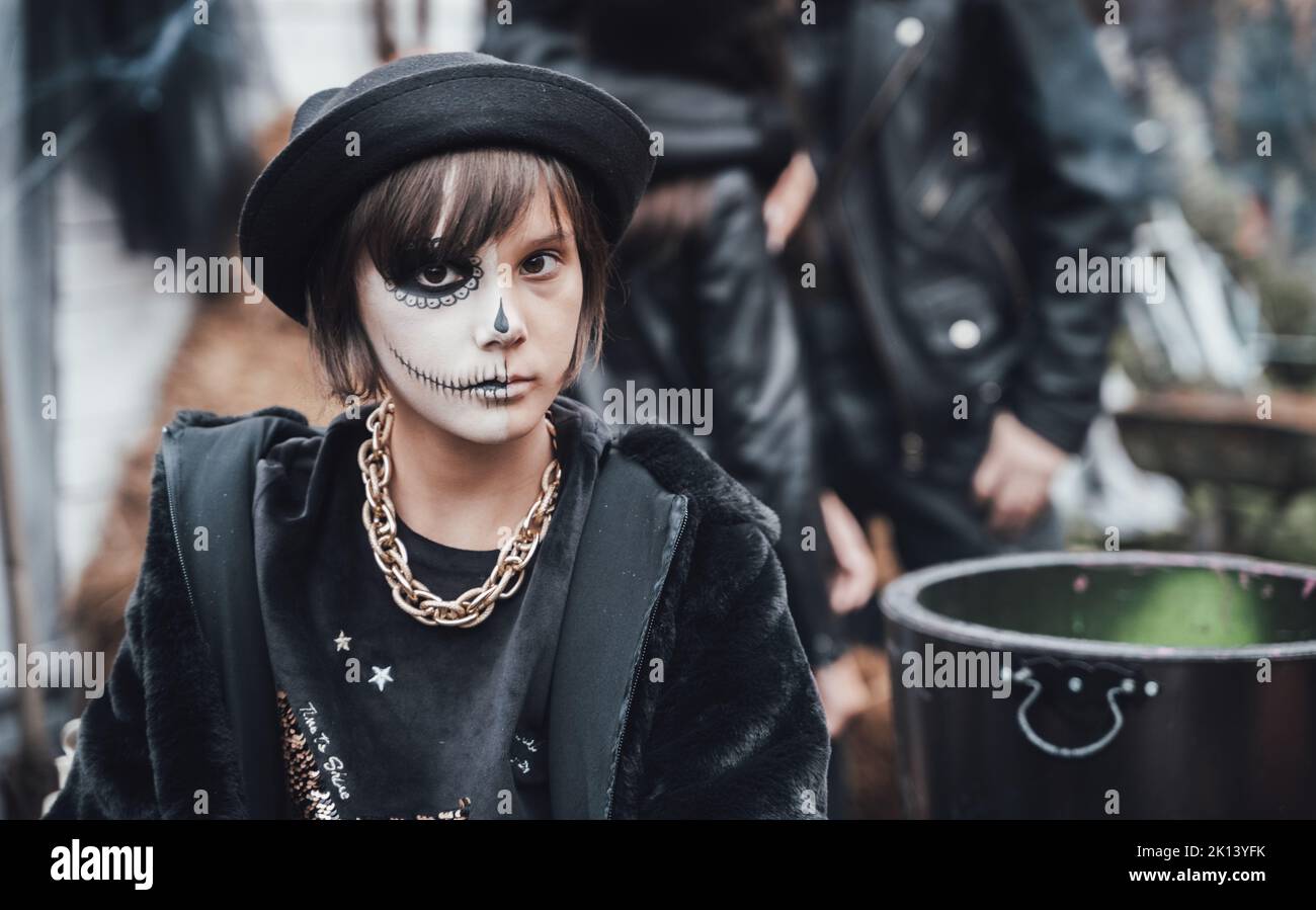 Beautiful scary little girl celebrating halloween. Terrifying black ...
