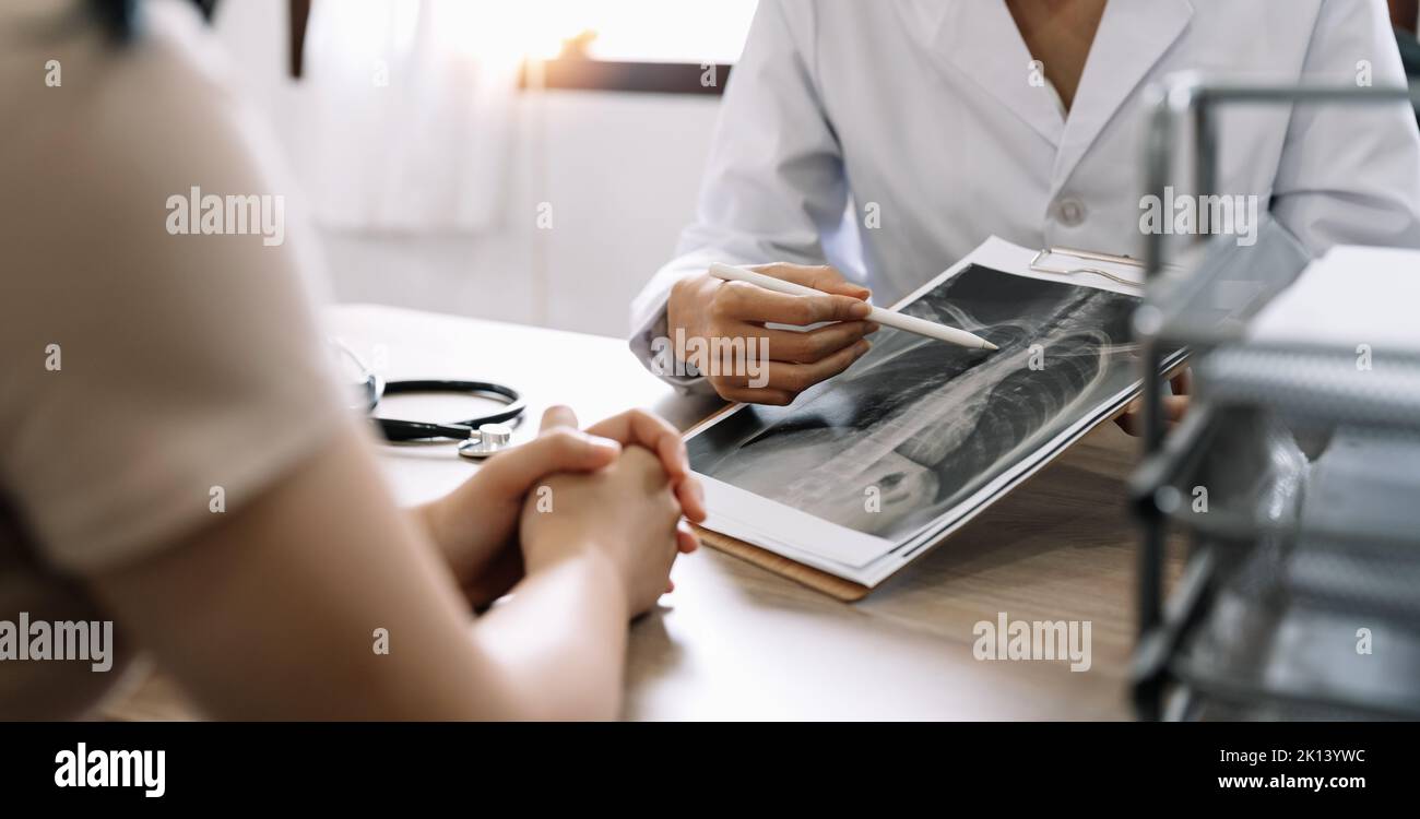 Doctor showing ray patient in hi-res stock photography and images - Alamy