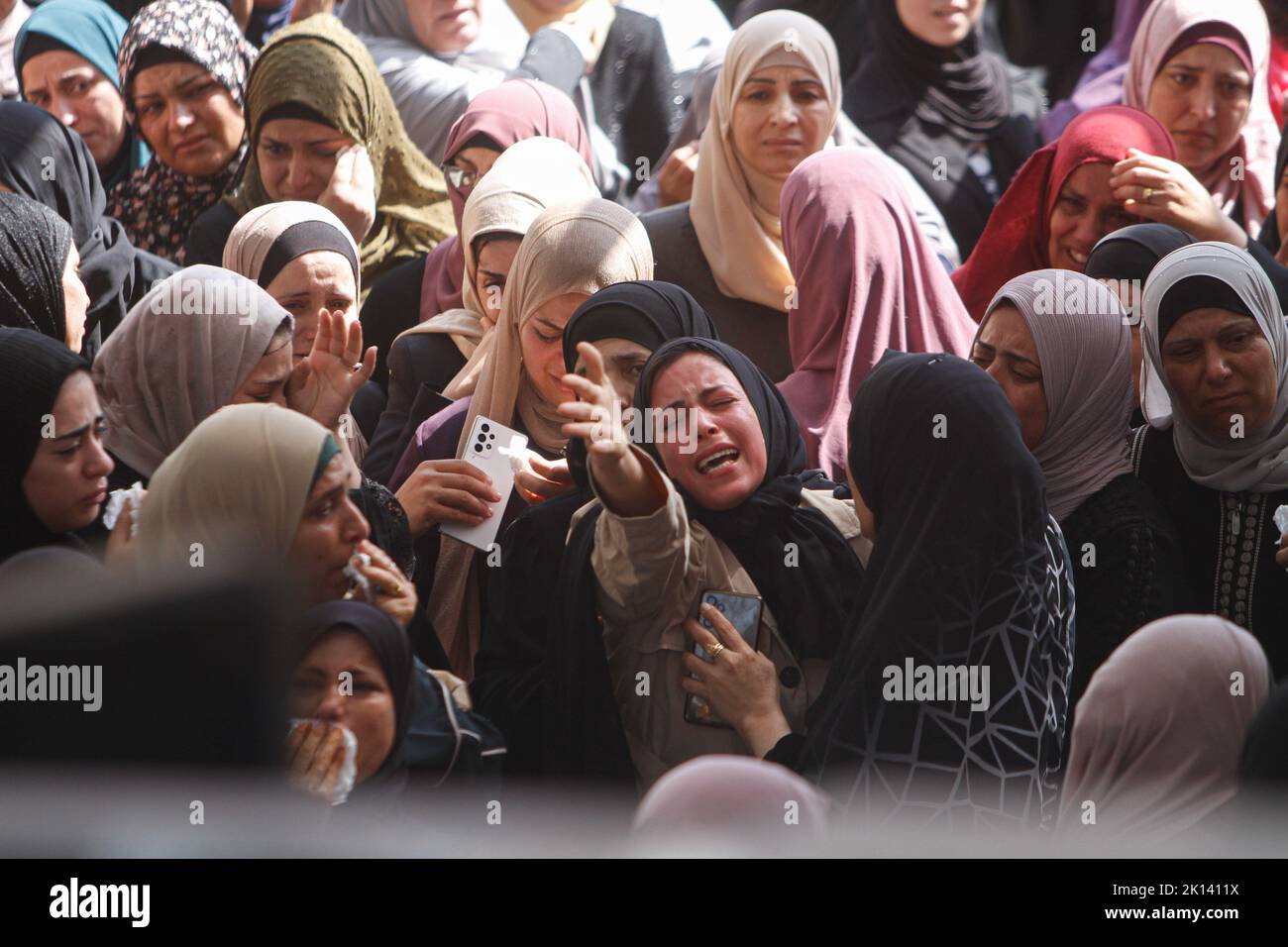 Jenin, Palestine. 15th Sep, 2022. Relatives mourn during the funeral of ...
