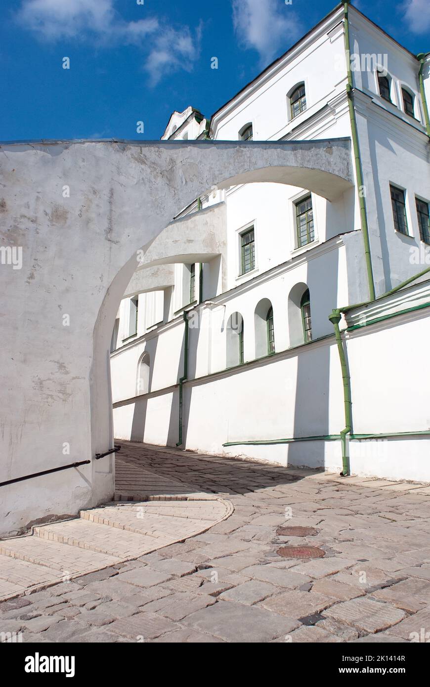 Stone white arches of the monastery building Stock Photo - Alamy