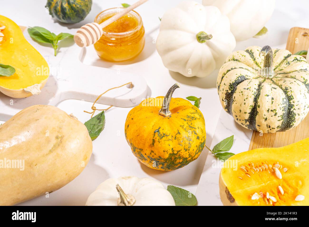 Pumpkins cooking background with various sizes, types and colors ...