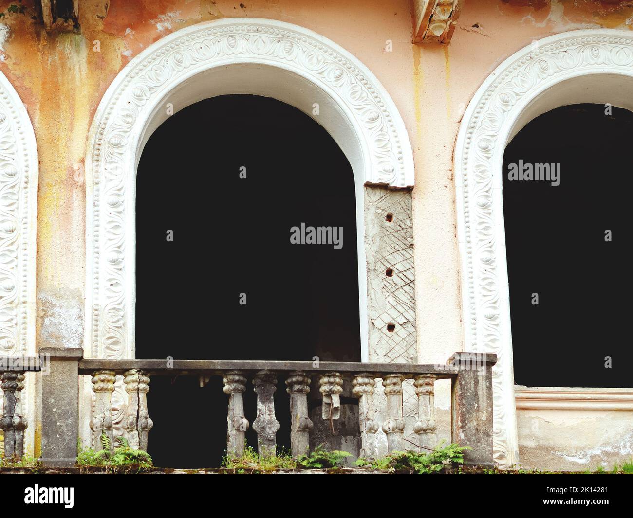 Arched opening from the balconies of an ancient abandoned building ...