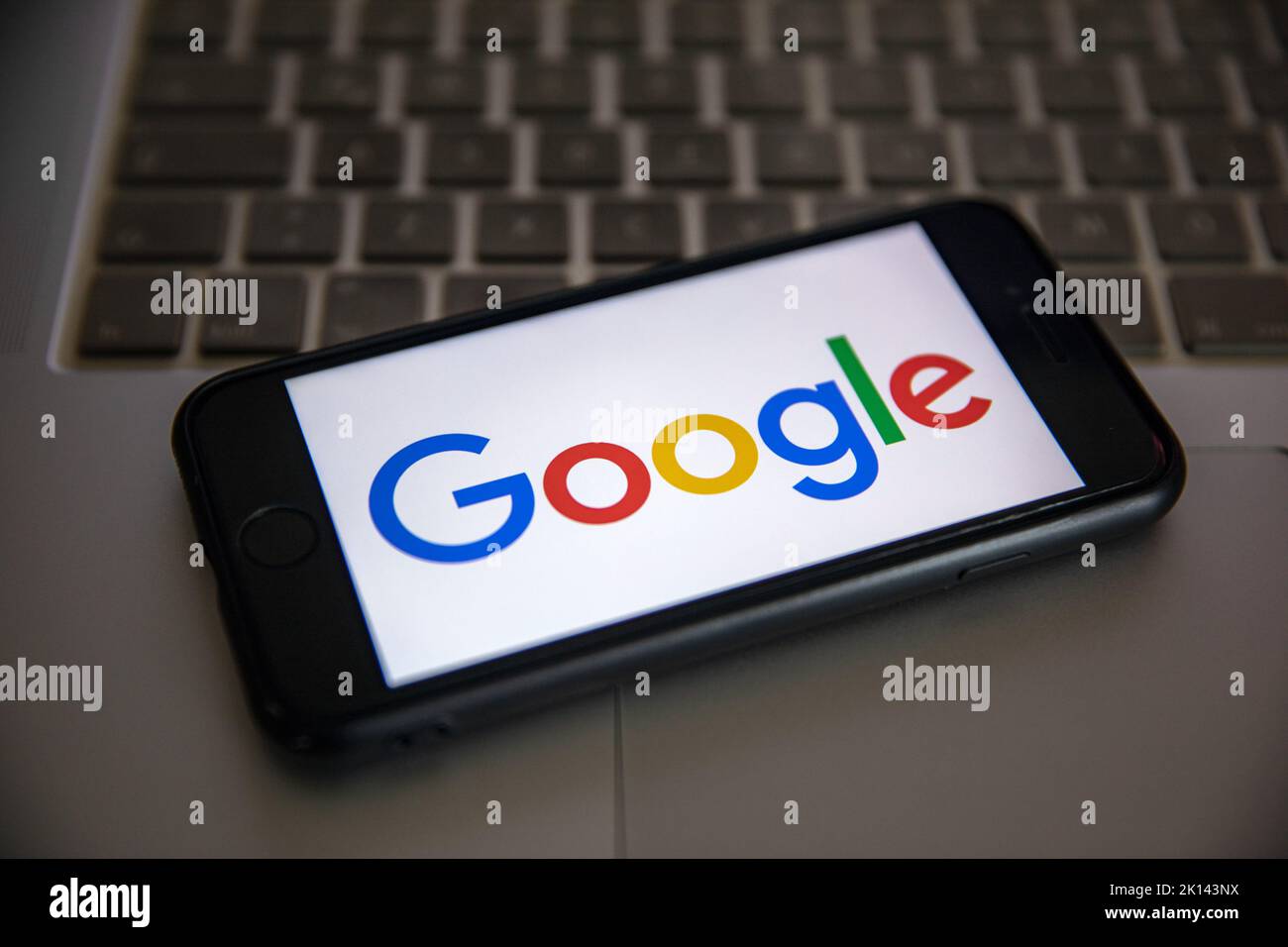 In this photo illustration, Google logo seen displayed on a smartphone ...
