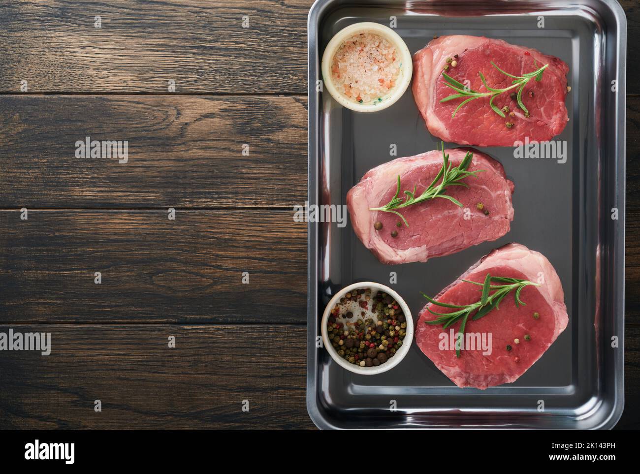 Steaks. Fresh Filet mignon Steaks with spices rosemary and pepper in ...