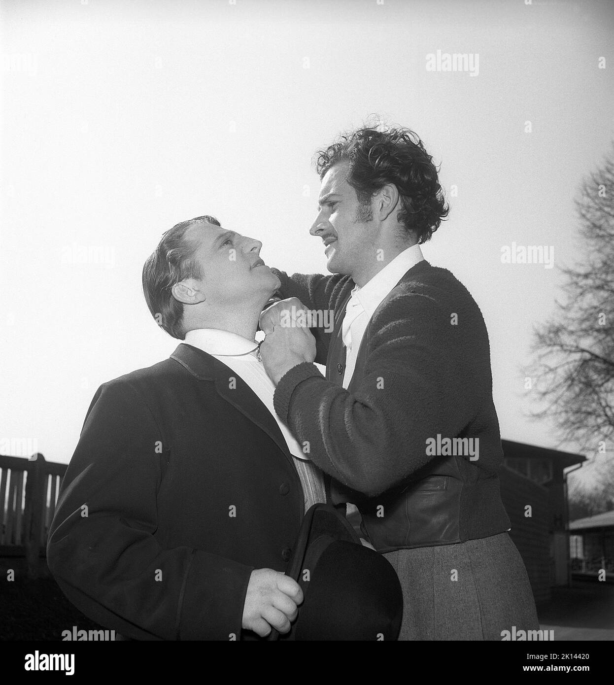Men of the 1940s. Two men in a fight although by the looks of it, the ...