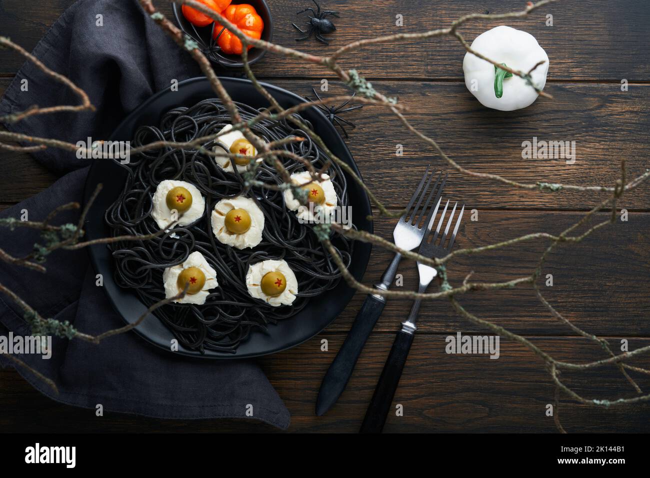 Halloween party Italian black pasta decorated horror olives like eyes ...