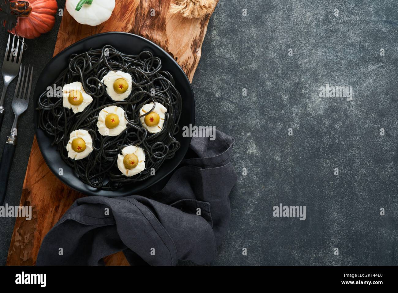 Halloween party Italian black pasta decorated horror olives like eyes ...