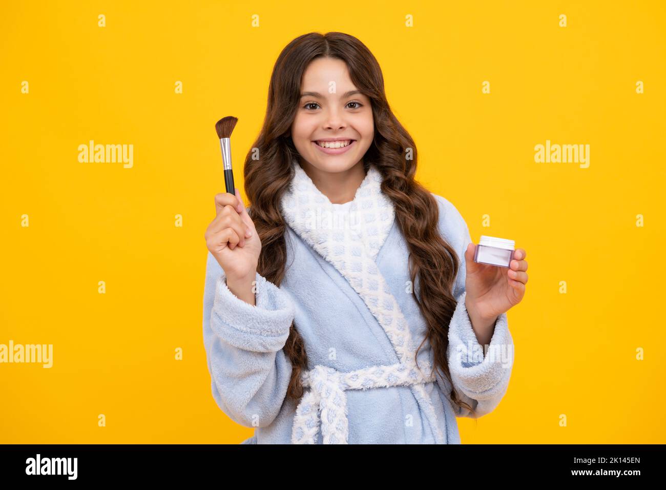 Beauty, make up and kids cosmetics. Teenage girl with brush applying ...