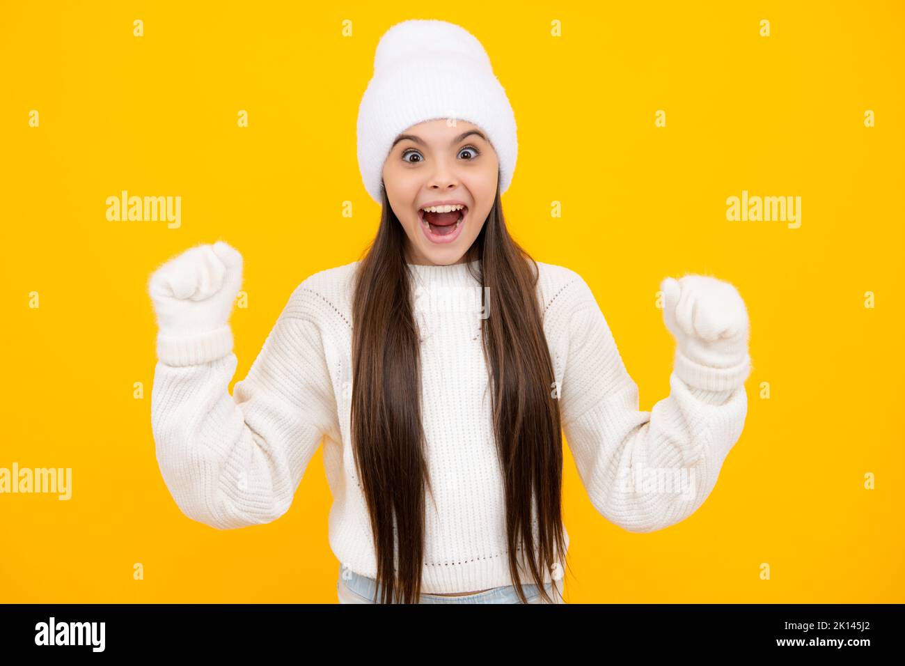 Child girl rejoicing, say yes, looking happy and celebrating victory ...