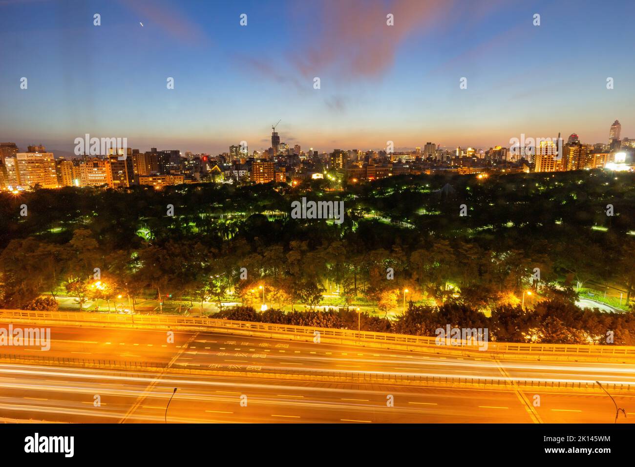 Sunset high angle view of the Daan Forest Park and cityscape at Taipei ...