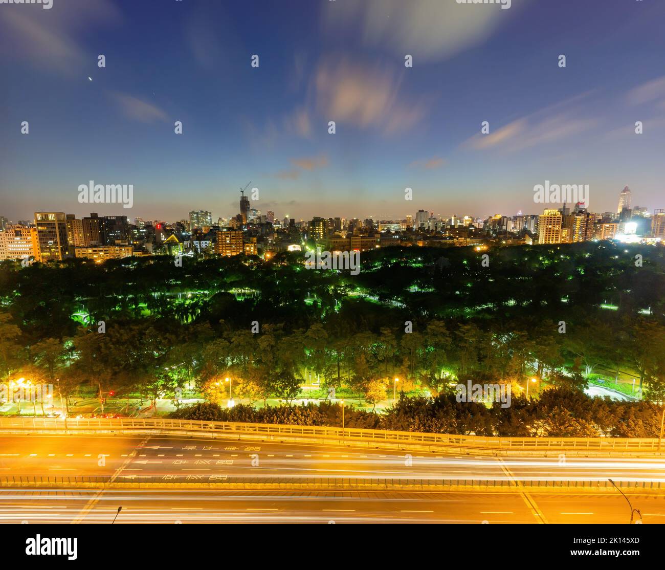 Sunset high angle view of the Daan Forest Park and cityscape at Taipei ...
