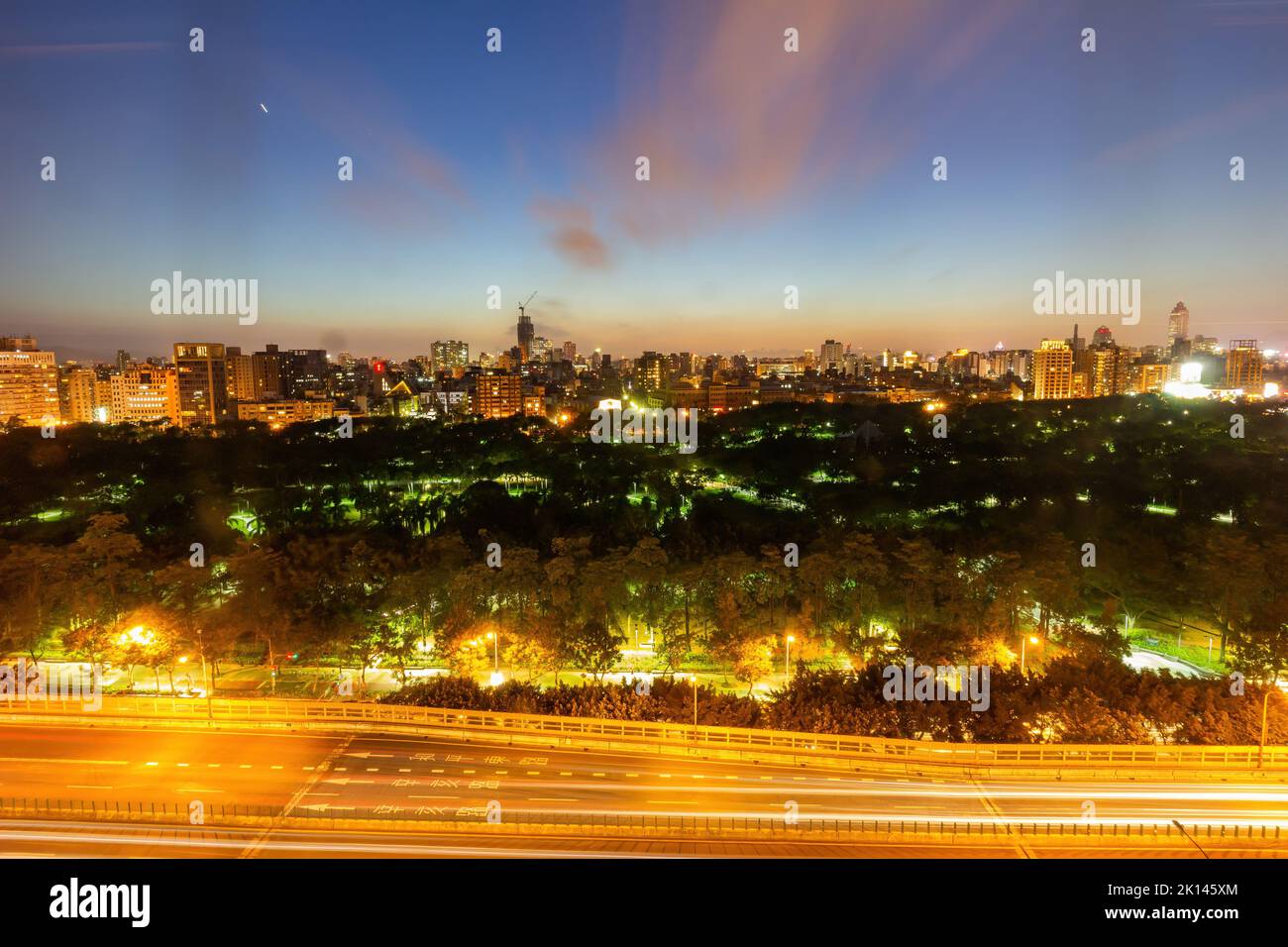 Sunset high angle view of the Daan Forest Park and cityscape at Taipei ...