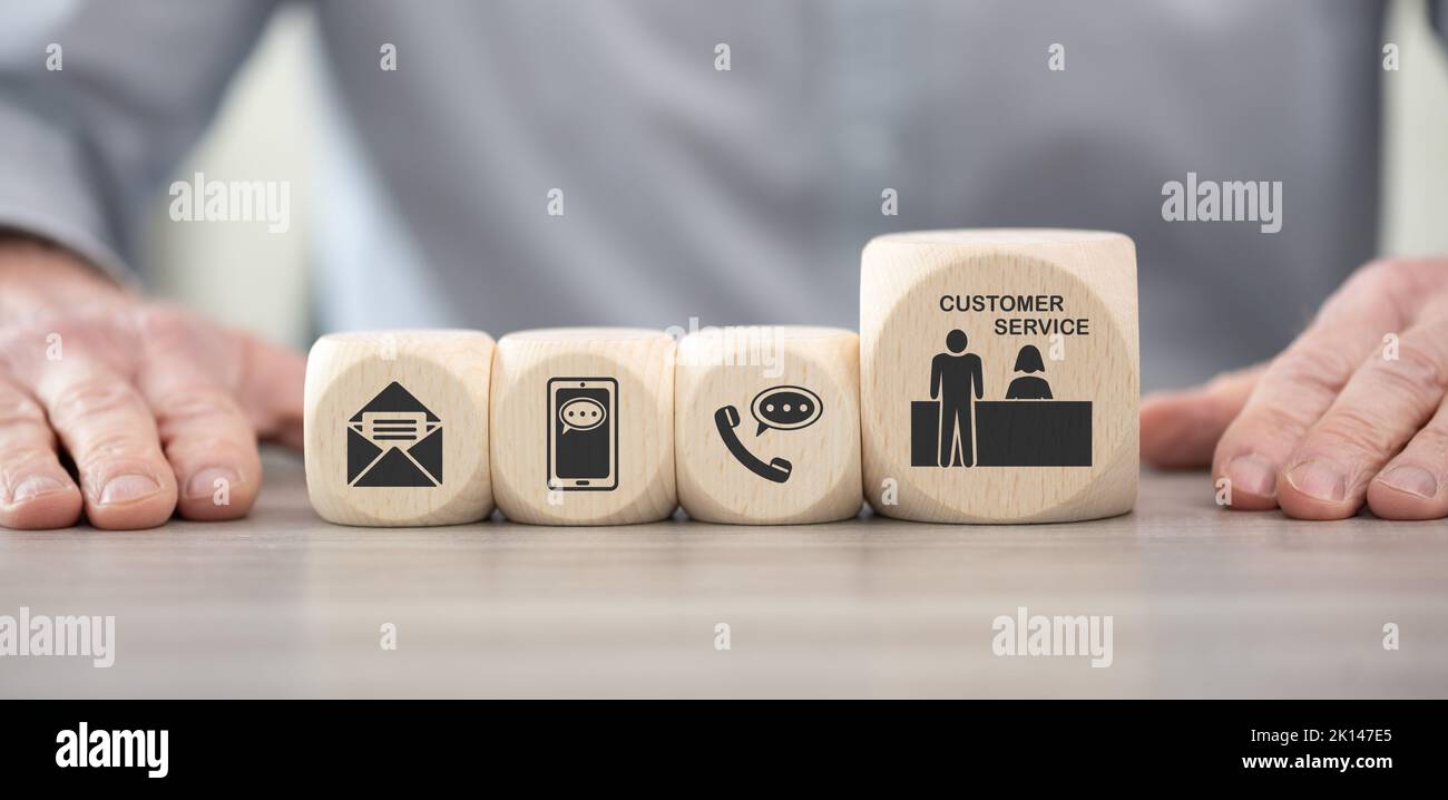 Wooden blocks with symbol of customer service concept Stock Photo - Alamy