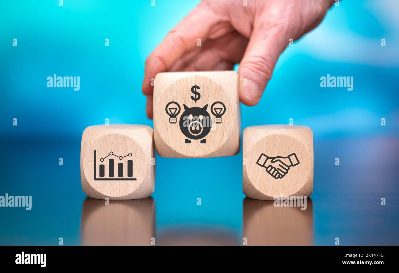 Wooden blocks with symbol of crowdfunding concept on blue background ...