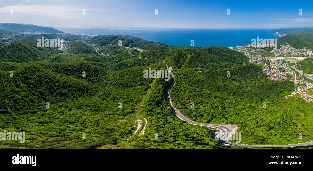 Aerial view of a curved winding road trough the mountains Stock Photo ...