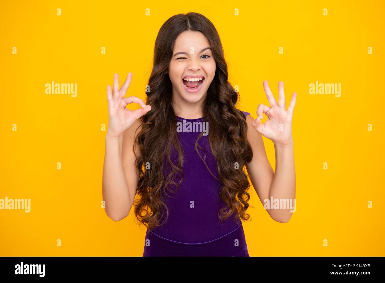 Emotional portrait of caucasian teen girl. Funny teenager making ok ...