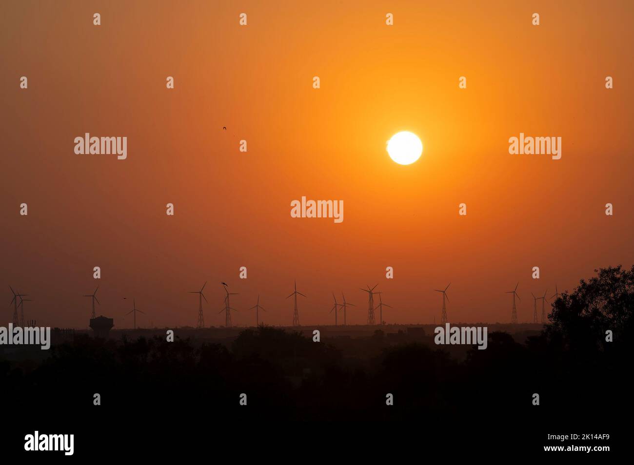 Sun rising on Thar desert, Jaisalmer, Rajasthan, India. Windmills in ...