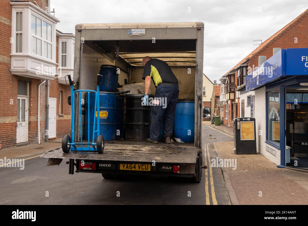 Man loading drums of oil hi-res stock photography and images - Alamy