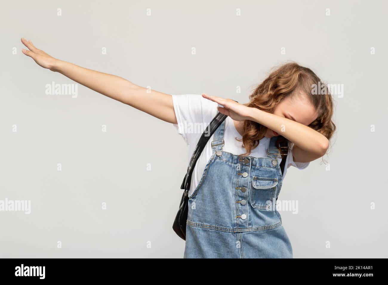 dab gesture winner posture schoolgirl exam success Stock Photo - Alamy