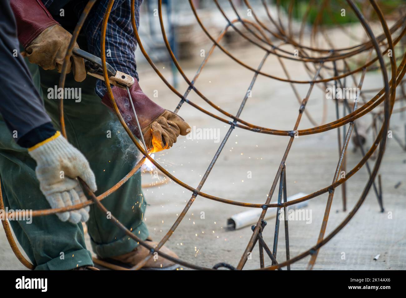 Blacksmith Technicians are welding several curve wires to form a ...