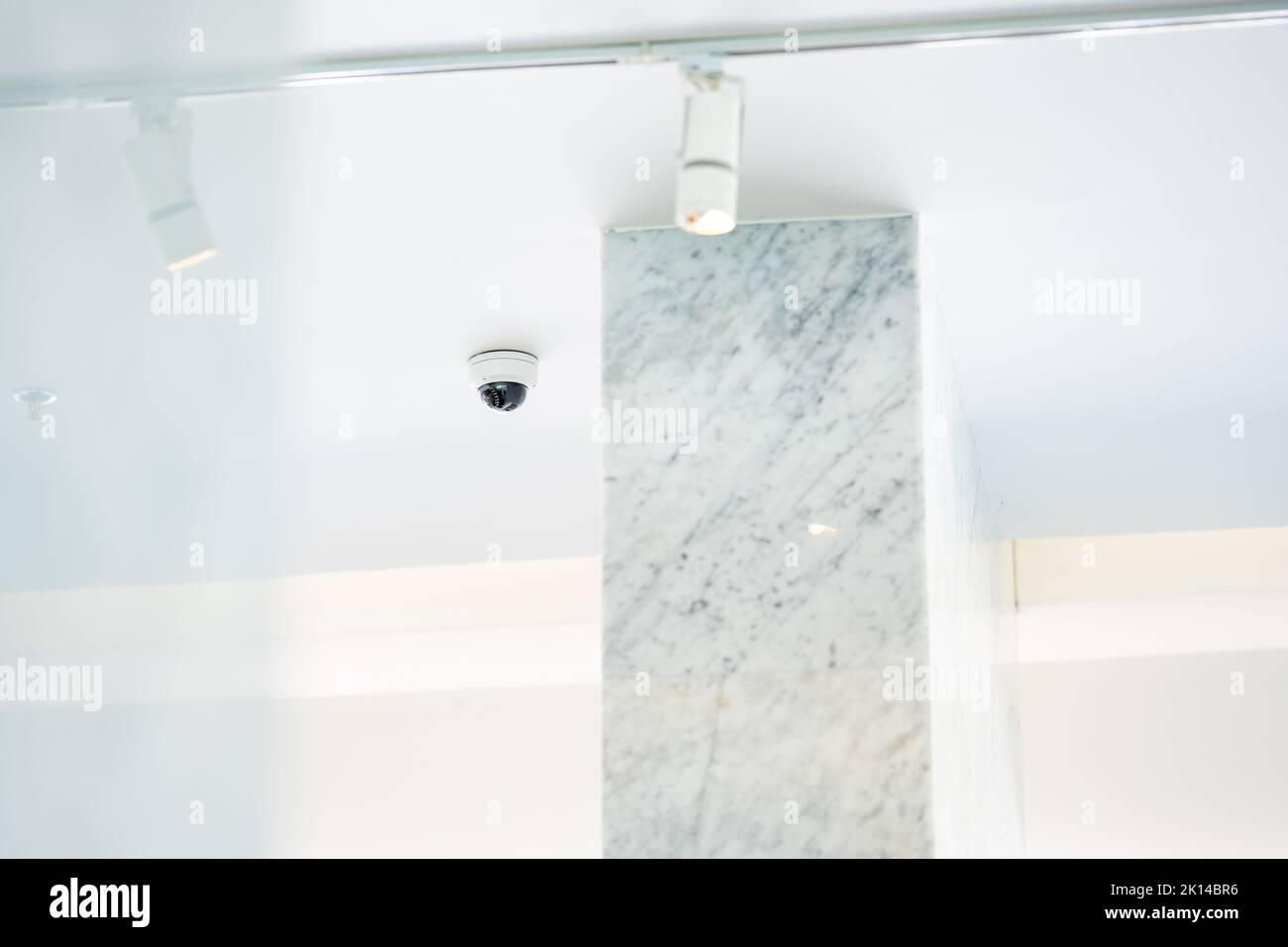 White CCTV with acrylic glass dome cover camera len in the centre ...