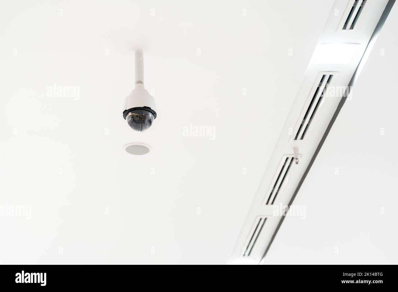 White CCTV with acrylic glass dome cover camera len in the centre ...