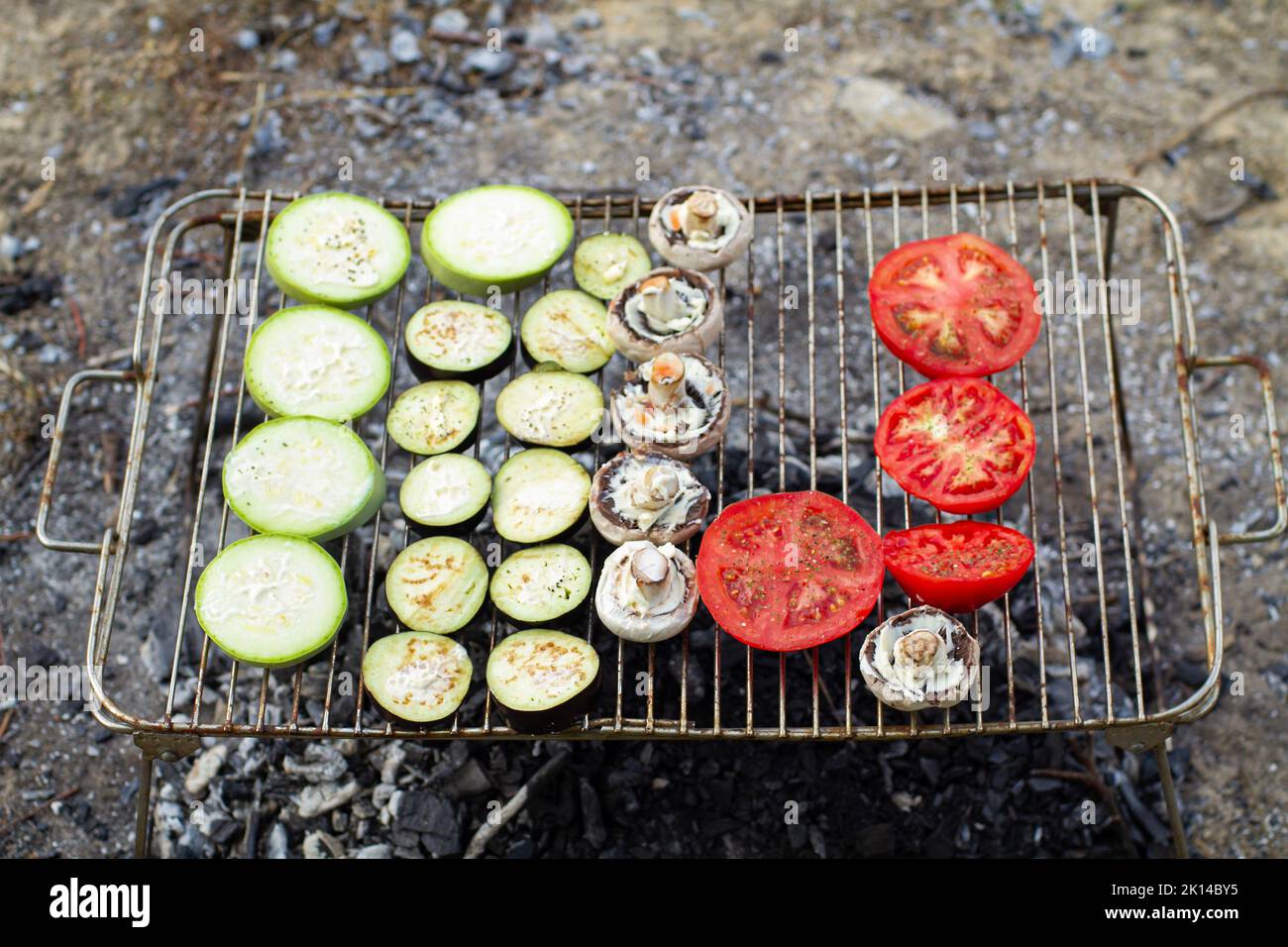 Grilling process of preparing vegetables on barbecue bbq grill. Ember ...