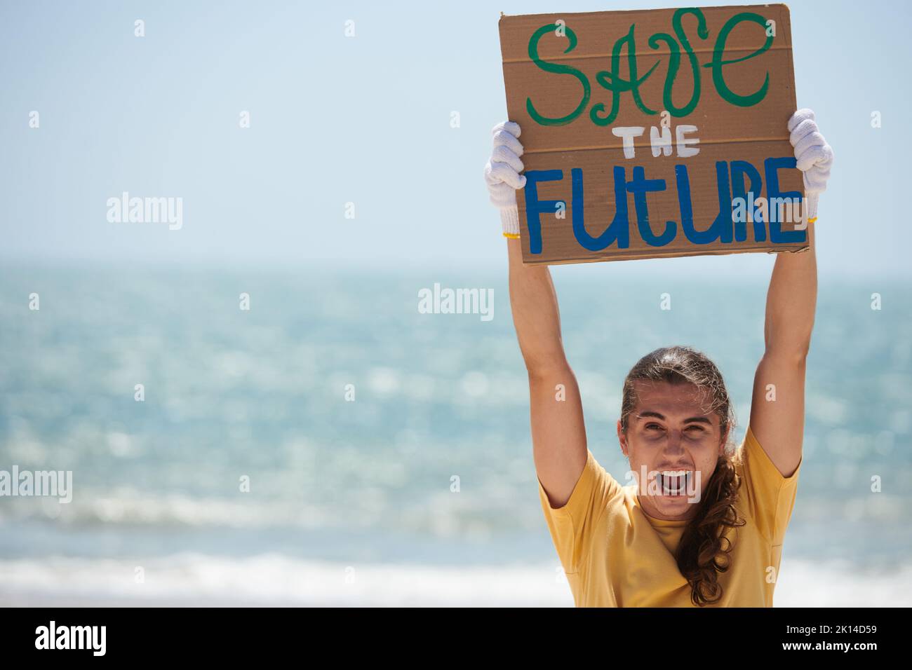 Portrait of shouting activist showing save the future placart Stock ...