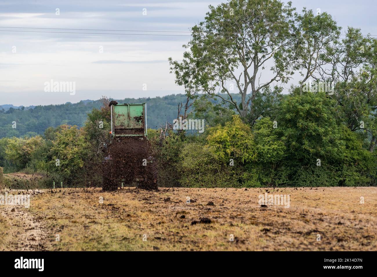 Modern agriculture. Muck spreading prior to ploughing Stock Photo - Alamy
